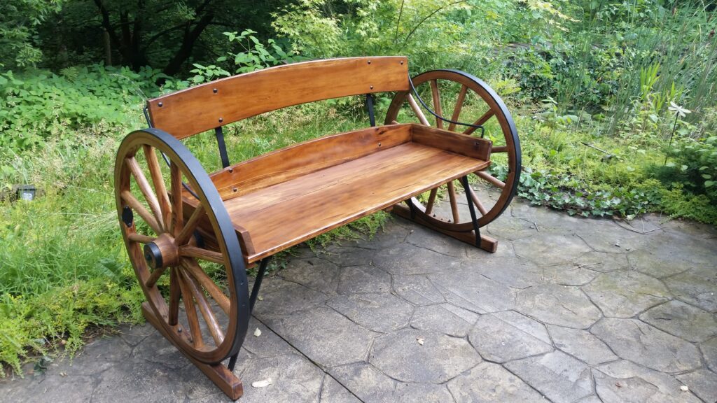 Rustic Wagon Wheel Bench in Lexington, OH