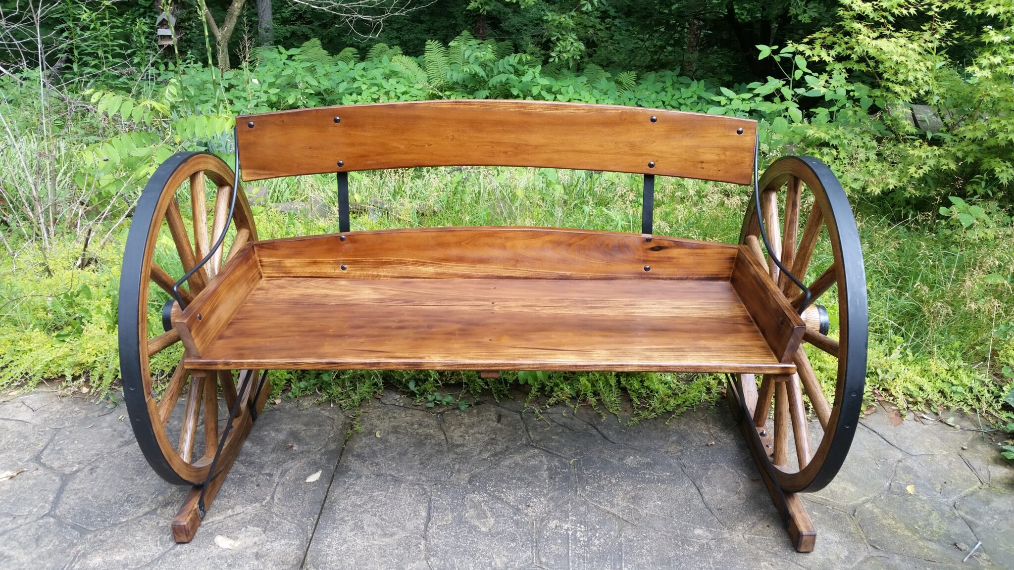 Rustic Wagon Wheel Bench in Lexington, OH