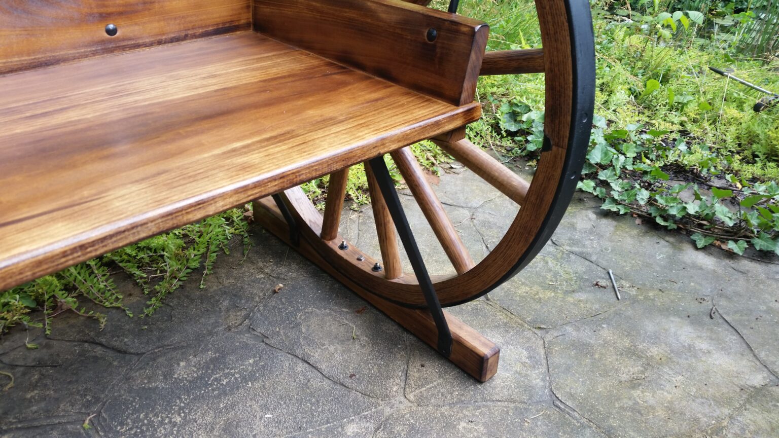 Rustic Wagon Wheel Bench in Lexington, OH